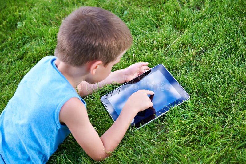 Little Boy with Tablet Pc on Grass Stock Image - Image of leisure ...