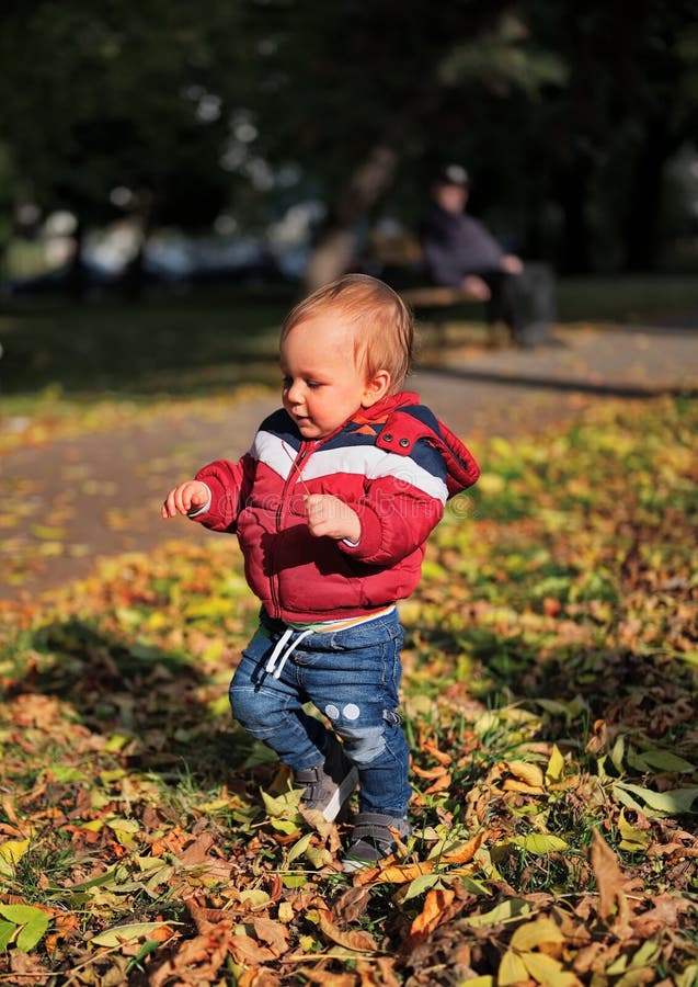 Little Boy Taking His First Steps Stock Photo - Image of male, cold ...