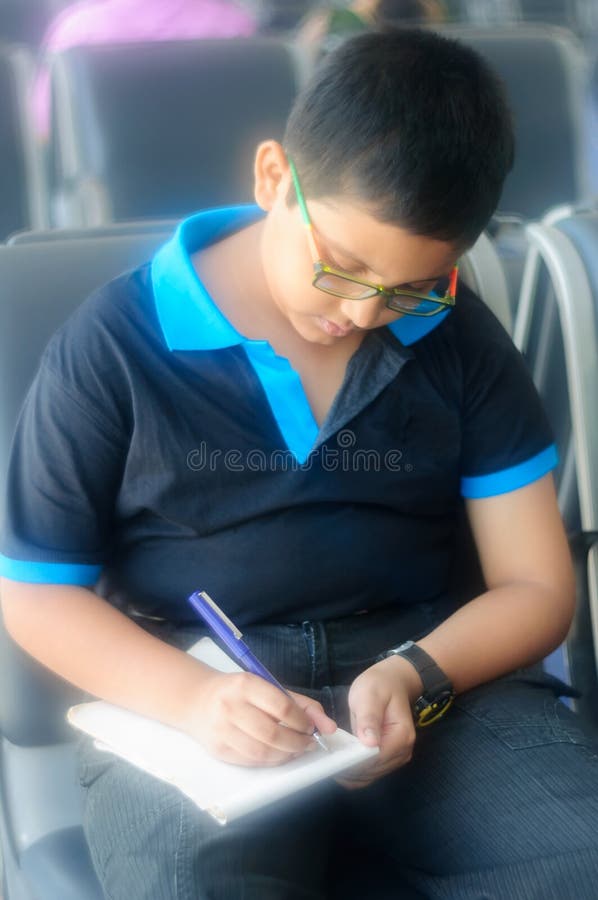 Little boy taking notes stock photo. Image of person - 45461176