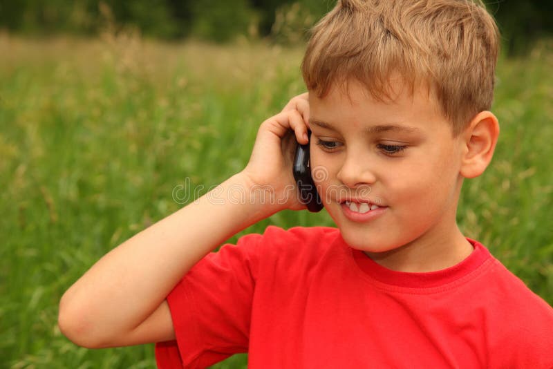 Little Boy Talking on Cell Phone Outdoors Stock Photo - Image of green ...