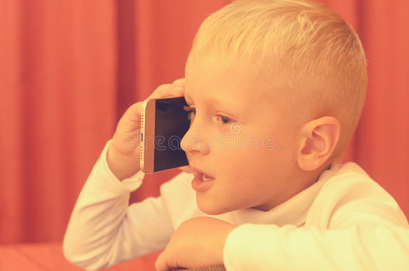 Little Boy Talking on the Phone Expressing His Emotions. Stock Photo ...