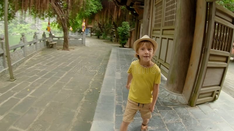 Little Boy Talks with the Camera, he is Making His Vlog for His Channel ...