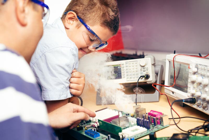 Little Boy and Teacher in Class with Electronic Project Stock Image ...