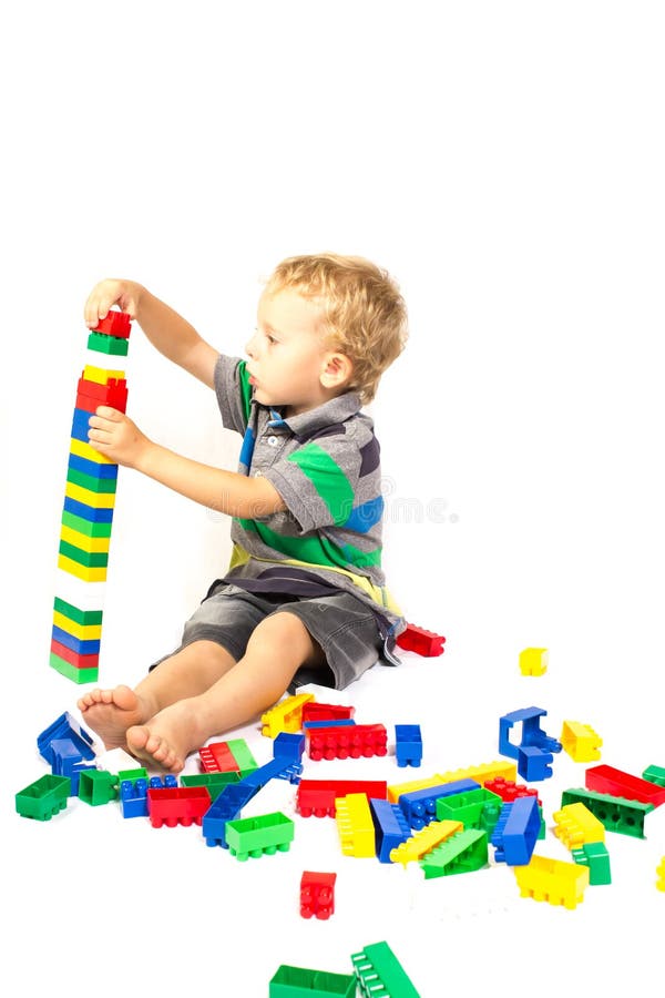A Little Boy To Build a Tower of Lego Stock Photo - Image of look ...