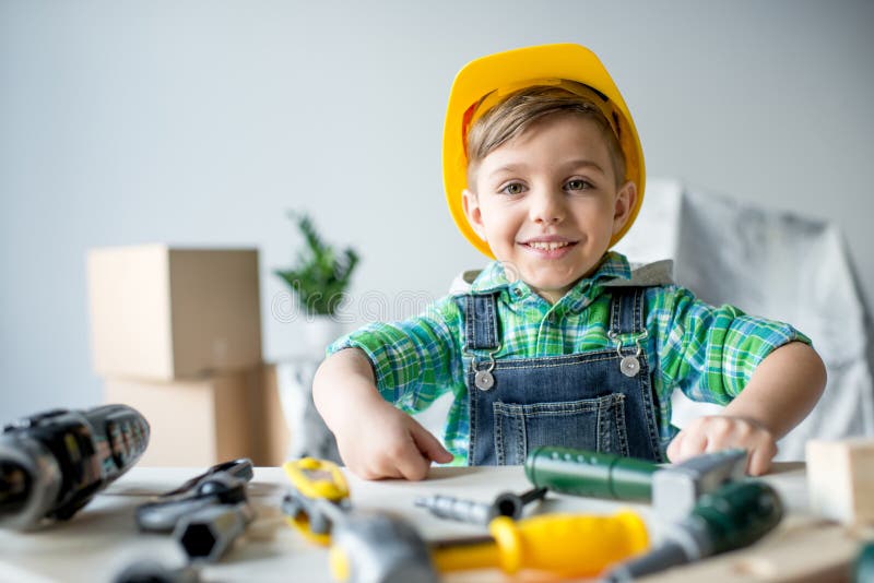 Little boy with tools stock image. Image of professional - 90730995