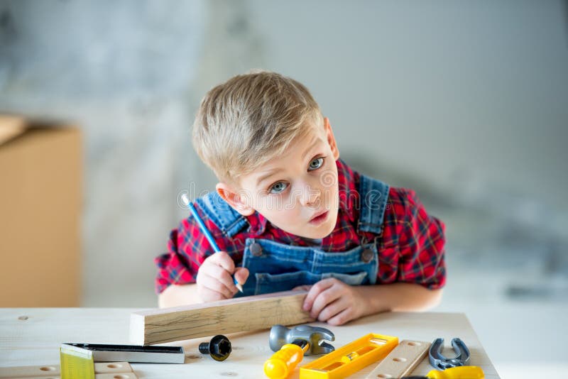 Little boy with tools stock photo. Image of workshop - 90730778