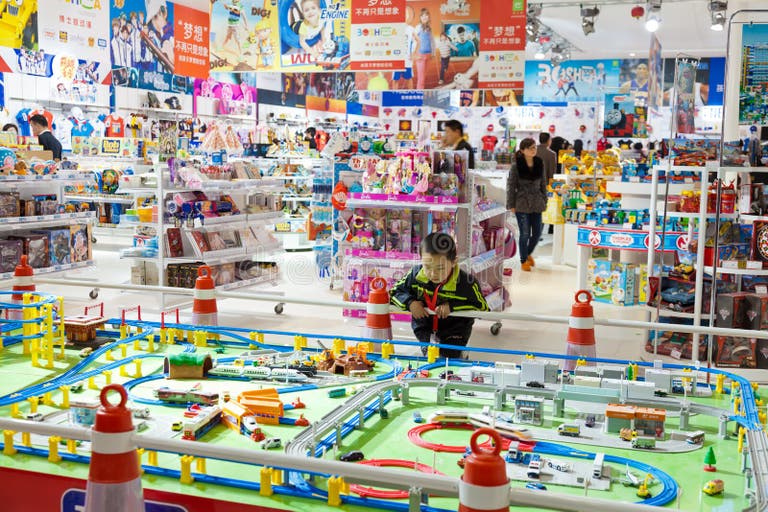 Little boy in toy store editorial stock image. Image of merchandise ...