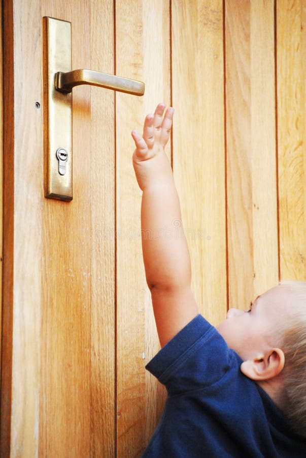 Little Boy Try To Reach Door Handle Stock Image - Image of open ...
