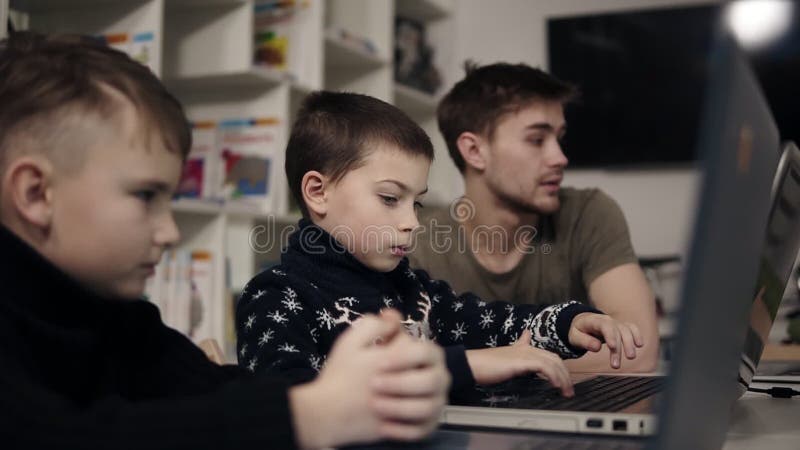 Little Boy is Trying To Type Something on Laptop Keyboard. Learning How ...