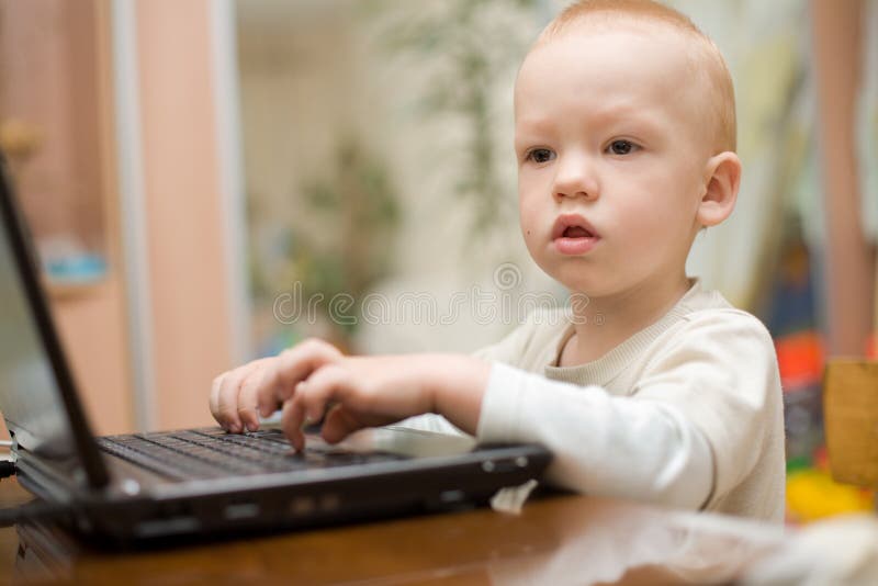 Little Boy Typing Text On Laptop At Home Stock Photo - Image of ...