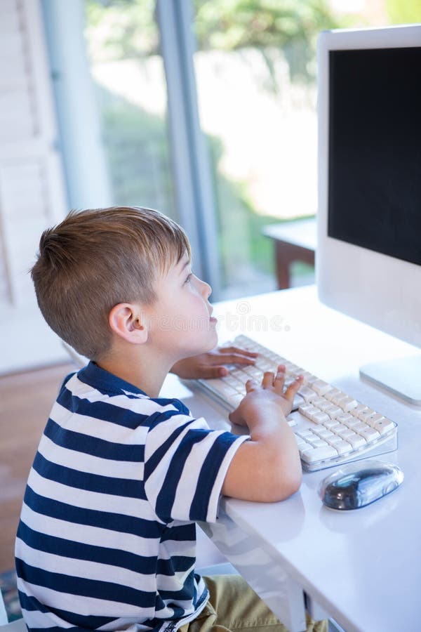 Happy Child Using Laptop at Home. School Girl Learning with Computer ...