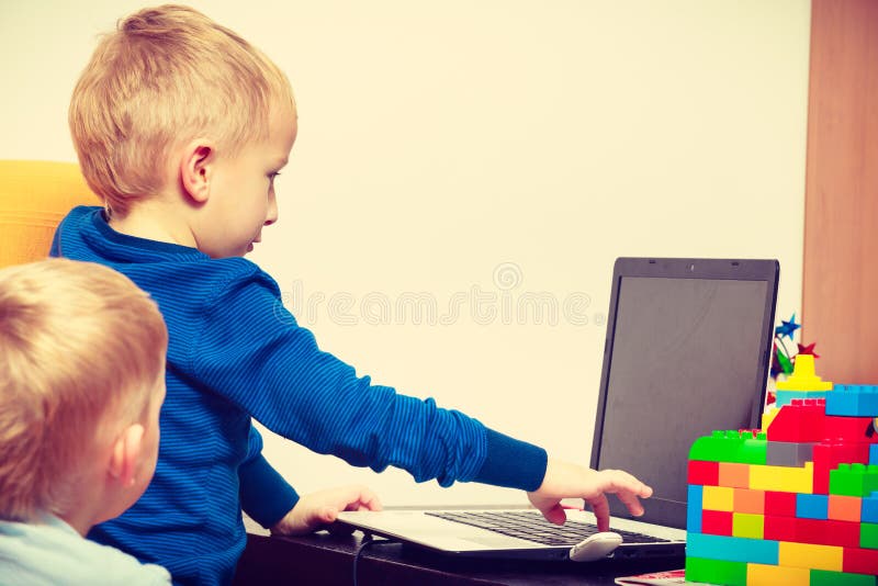 Little Boy Using Laptop Computer Playing Games Stock Photo - Image of ...