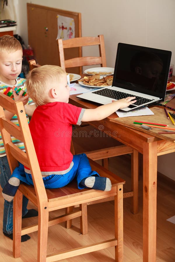 Little Boy Using Laptop Computer Playing Games Stock Photo - Image of ...