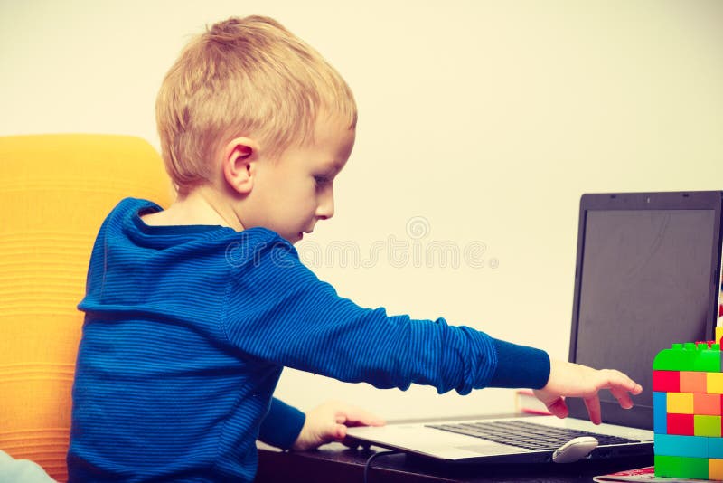 Little Boy Using Laptop Computer Playing Games Stock Image - Image of ...
