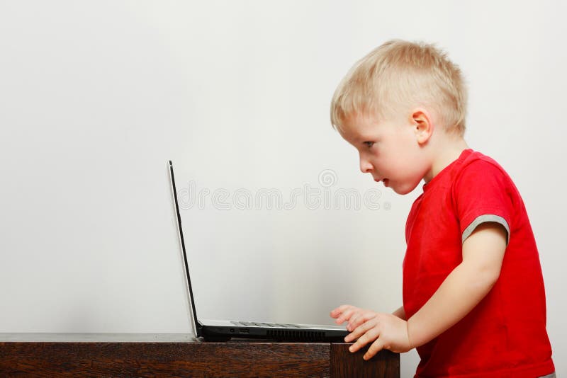 Little Boy Using Laptop Computer Playing Games Stock Image - Image of ...