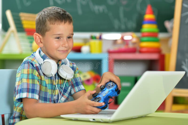 Little boy using laptop stock image. Image of laptop - 122083135