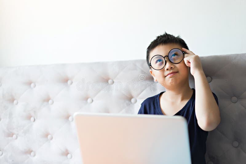Little Boy Using Laptop Learning about Technology at Home for Education ...