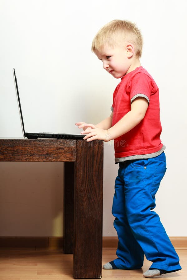 Little Boy Using Laptop Pc Computer at Home Stock Image - Image of ...