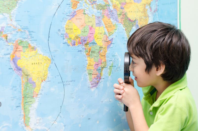 Little Boy Using Magnify Looking Map Stock Photos - Free & Royalty-Free ...