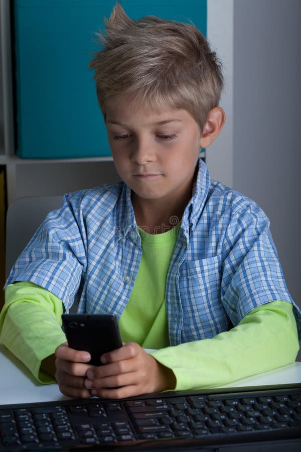 Little Boy Using Smartphone Stock Photo - Image of child, shirt: 46060174