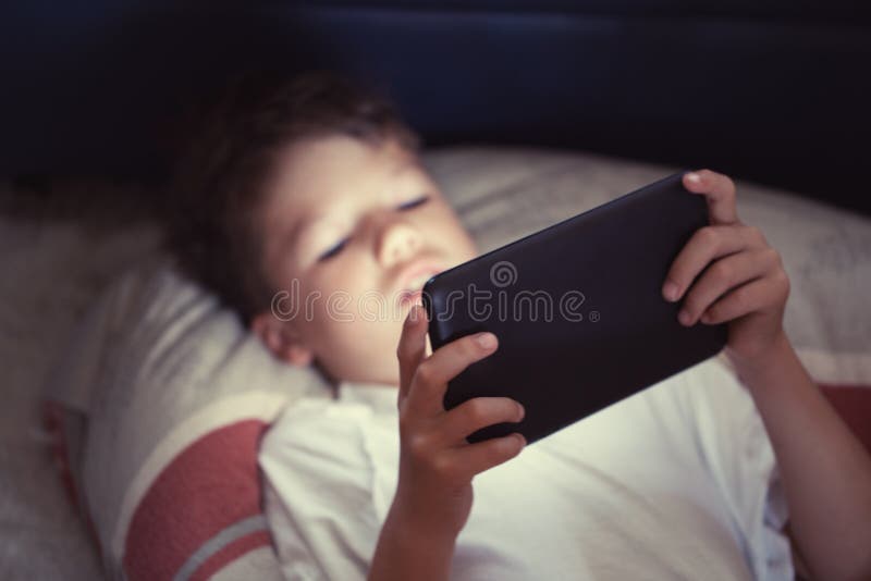 Little Boy Using Tablet at Night in Bedroom Stock Image - Image of ...