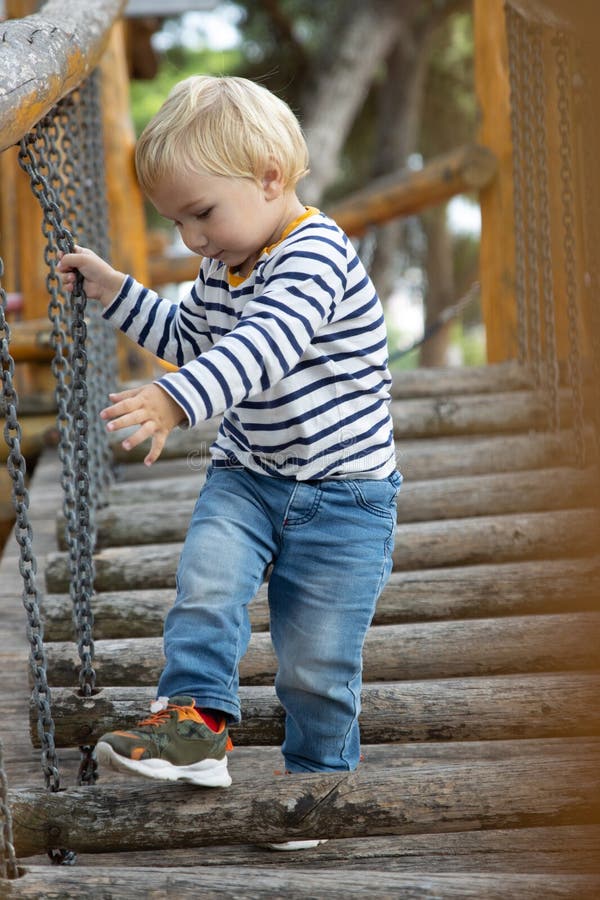 Little Boy Walking Down the Stairs on the Playground Stock Image ...
