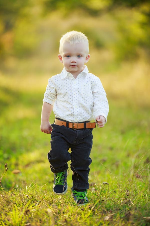 Little Boy Walking in Nature Stock Photo - Image of pleasure, field ...
