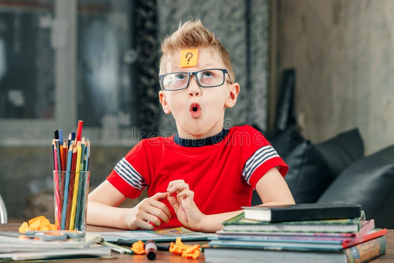 The Little Boy Was Thinking, Sticking a Sticker on His Forehead. Solves ...