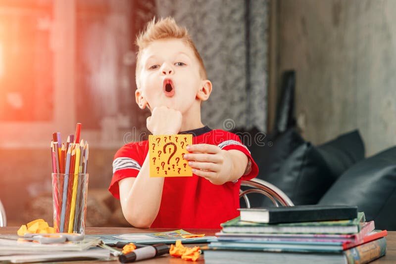 The Little Boy Was Thinking, Sticking a Sticker on His Forehead. Solves ...