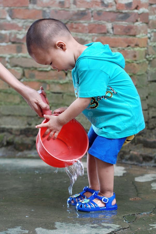Little Boy Washing His Feet Stock Image - Image of background, teach ...