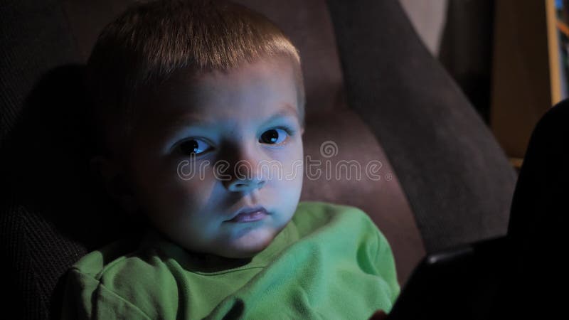 Little Boy Watching Mobile Phone Screen on Sofa. Gadget Addiction Stock ...