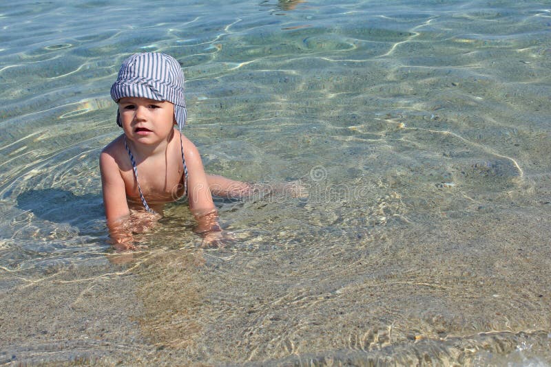 Little boy in water stock image. Image of lifestyle, happiness - 46717141
