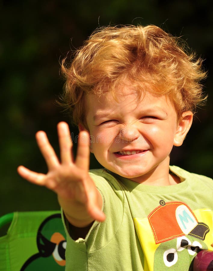 Little Boy Waving into the Sun Stock Photo - Image of waves, golden ...