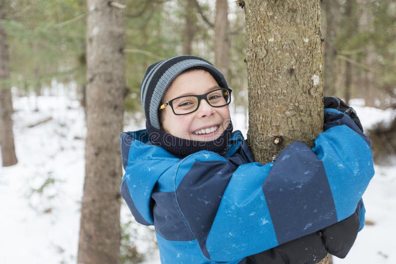 Little Boy in Winter with Hat in Snow Forest. Stock Photo - Image of ...