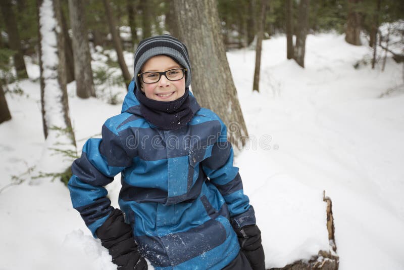 Little Boy in Winter with Hat in Snow Forest. Stock Image - Image of ...