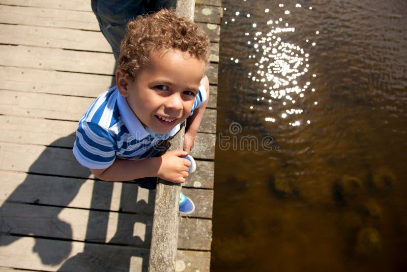 Little Boy on a Wooden Bridge Stock Image - Image of enjoying, bridge ...