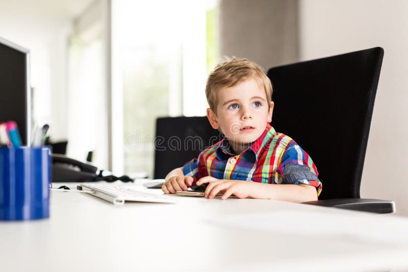 Little Boy Working in Office Stock Photo - Image of furniture ...