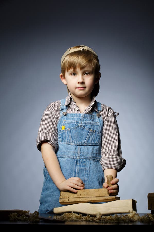 Little Boy Working with Plane Stock Image - Image of human, european ...