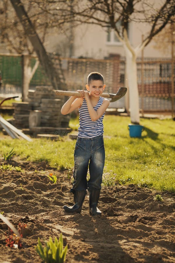 Little Boy Working with Shovel in Garden Stock Image - Image of farmer ...