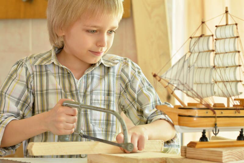 Little Boy Working with Wood Stock Image - Image of instrument, preteen ...