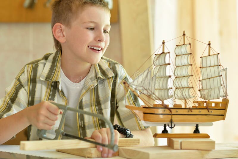 Little Boy Working with Wood Stock Photo - Image of child, ship: 78514088