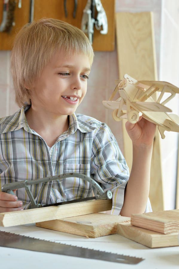 Little Boy Working with Wood Stock Image - Image of carpenter, power ...