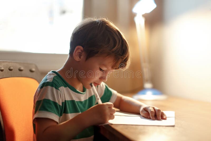 Little Boy Write To Blank Paper Stock Photo - Image of child, working ...