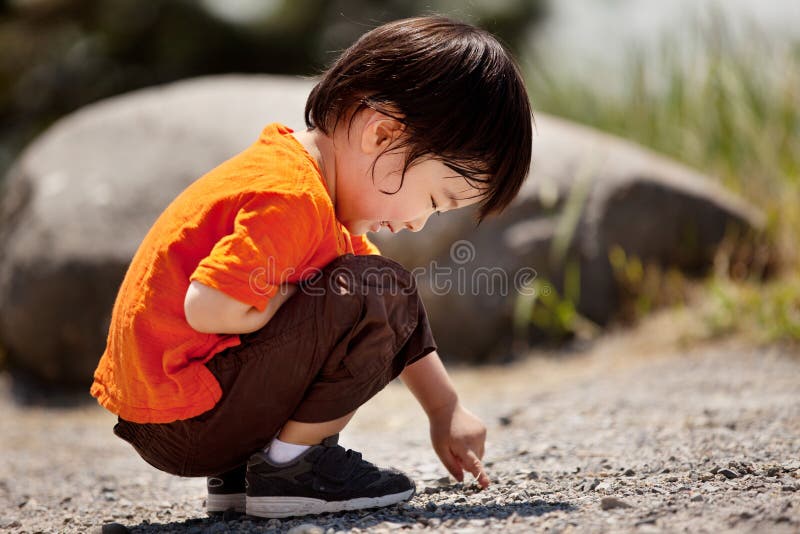 Little Boy Writing on the Ground Stock Image - Image of exploring ...