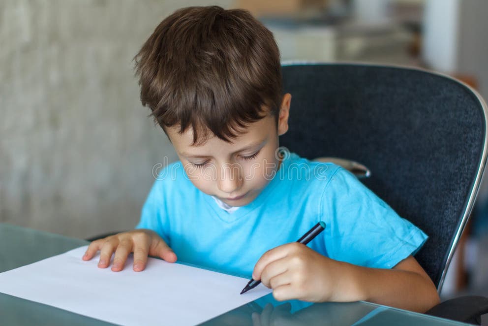 Little Boy Writing on Paper Stock Photo - Image of male, test: 33385482