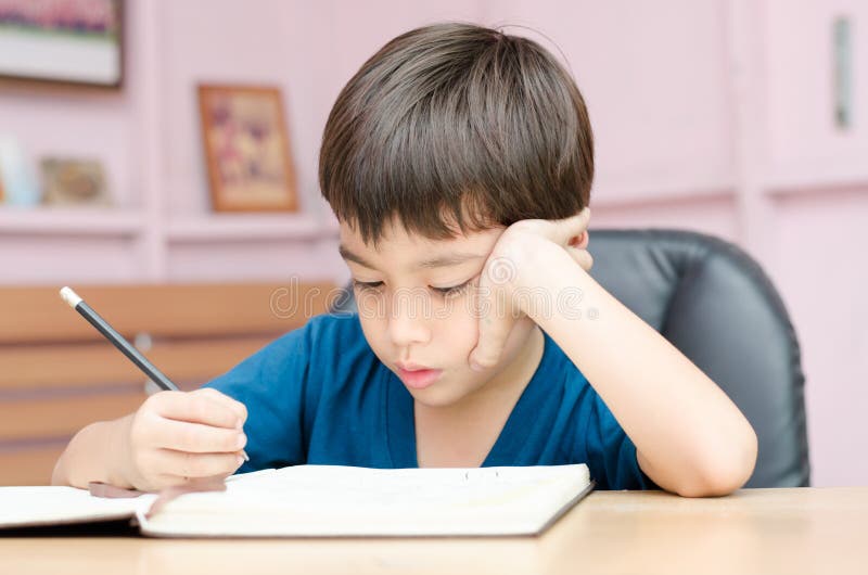 Little Boy Writing and Thinking Homework Stock Photo - Image of primary ...