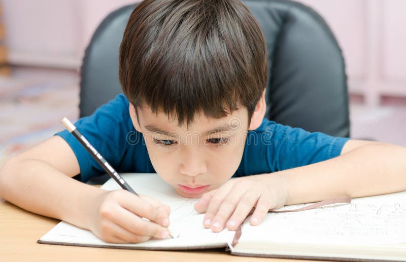 Little Boy Writing and Thinking Homework Stock Photo - Image of male ...