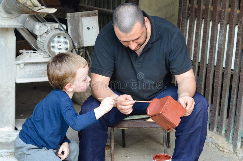 Little boy and his uncle stock image. Image of billboard - 53492943