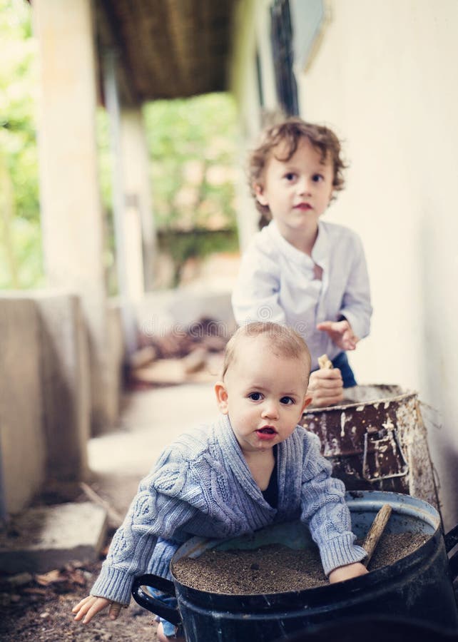 Little Boys Playing Outside the House Stock Photo - Image of holidays ...