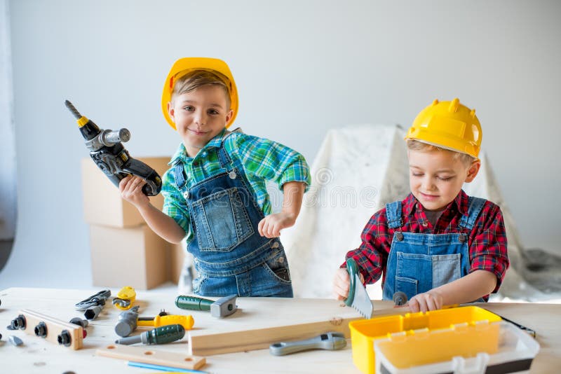 Little boys with tools stock image. Image of contractors - 90730777